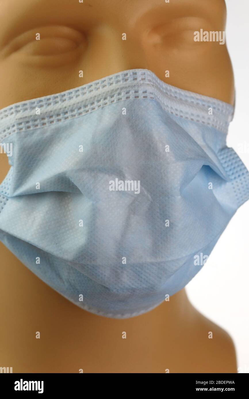 Blue medical face mask to avoid contagious diseases Stock Photo - Alamy