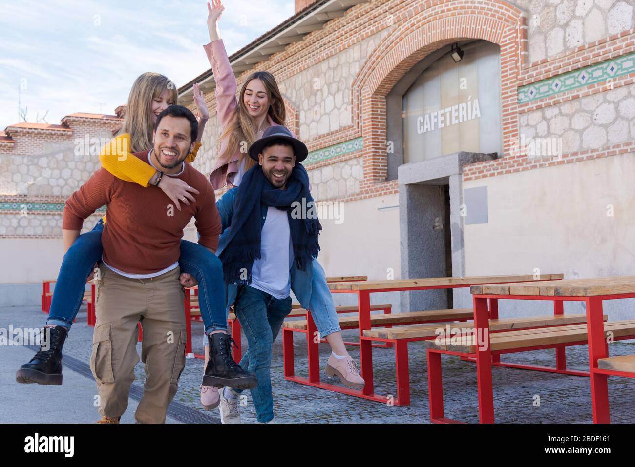 Two Latino boys together with their Caucasian girl partners enjoy and ...