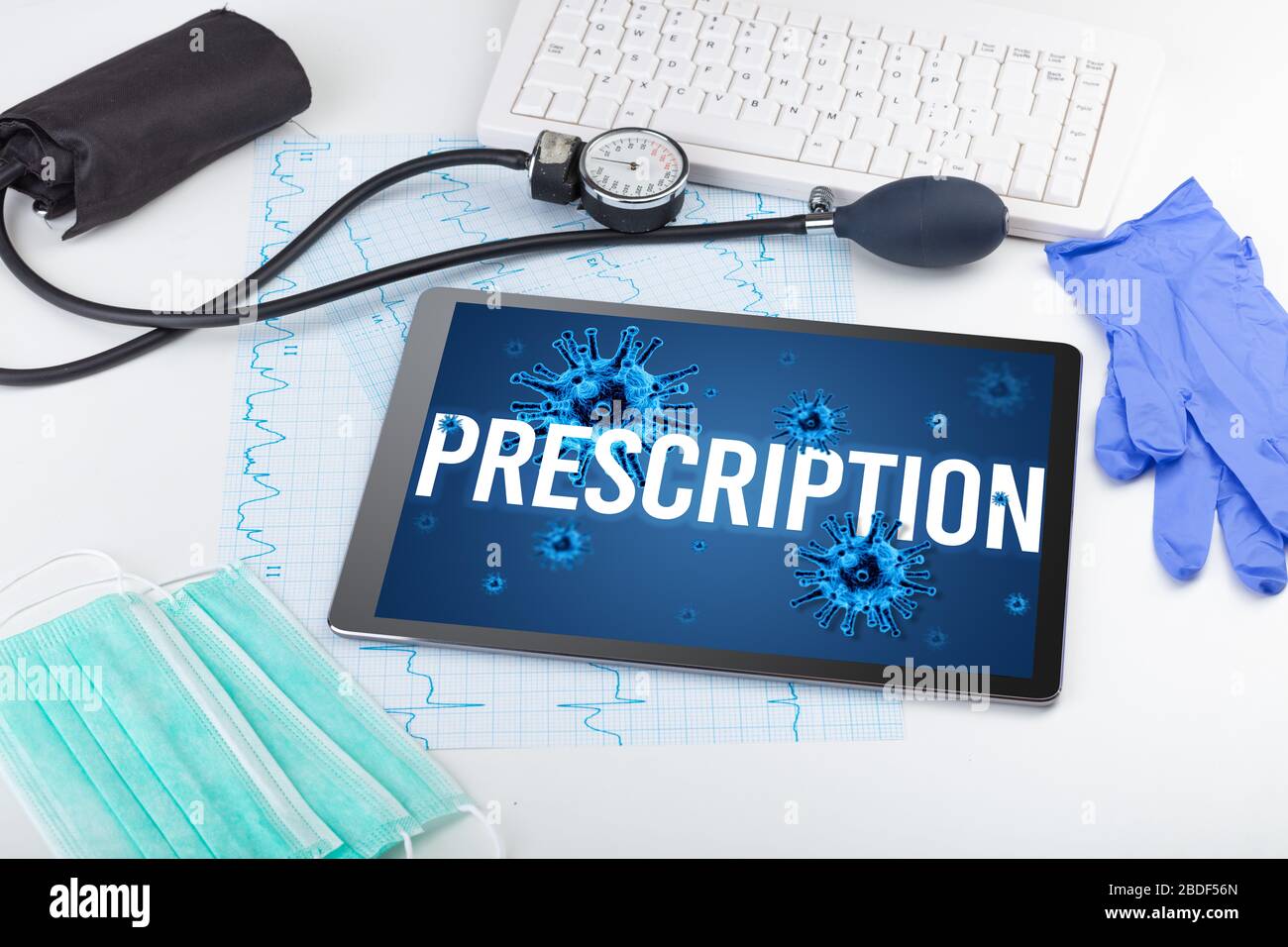 Tablet pc and doctor tools on white surface with PRESCRIPTION ...