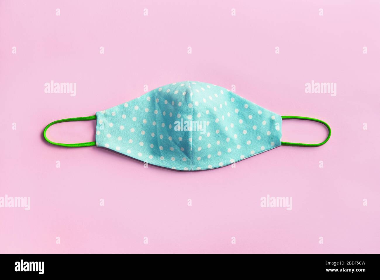 diy reusable face masks for viruses. pink background Stock Photo - Alamy