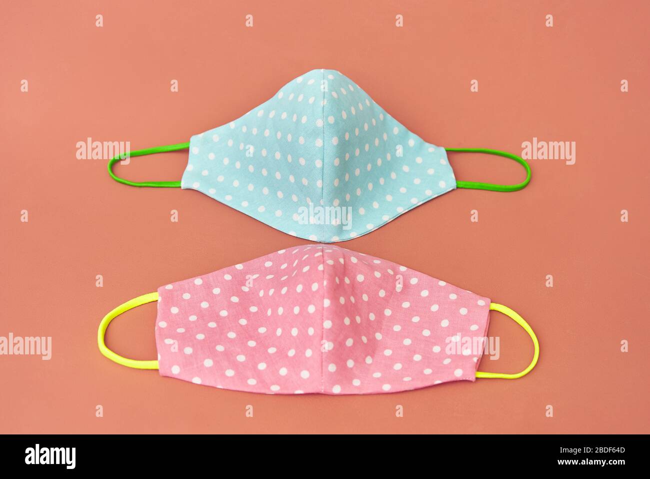 diy reusable face masks for viruses. pink background Stock Photo - Alamy