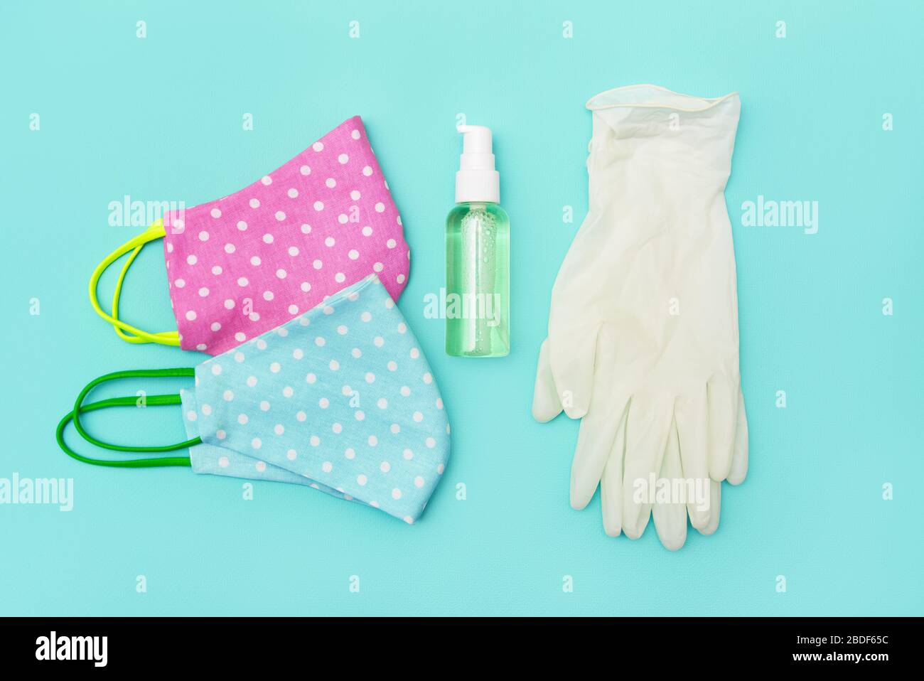 diy fabric face masks. medical gloves and sanitizer in bottle. aqua ...
