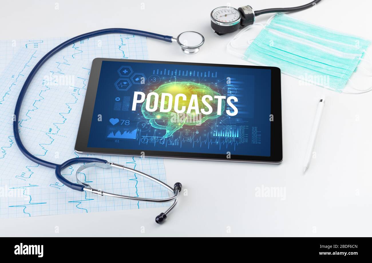 Tablet pc and medical tools with PODCASTS inscription, social ...