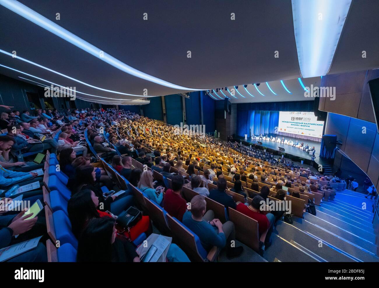 Attendees sitting in conference hall hi-res stock photography and ...