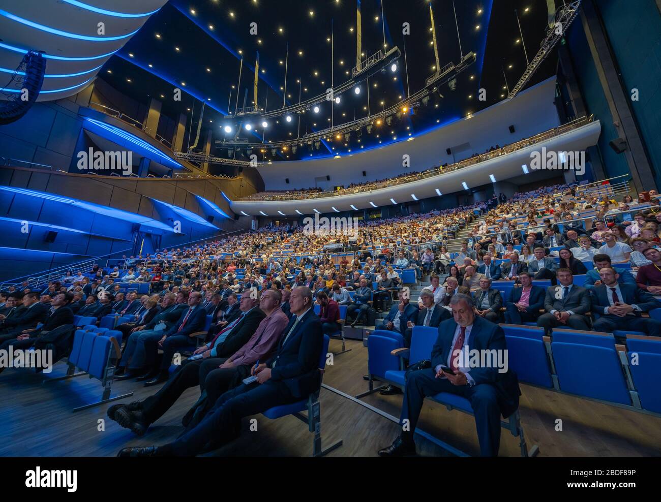 Business conference attendees sit and listen Stock Photo - Alamy