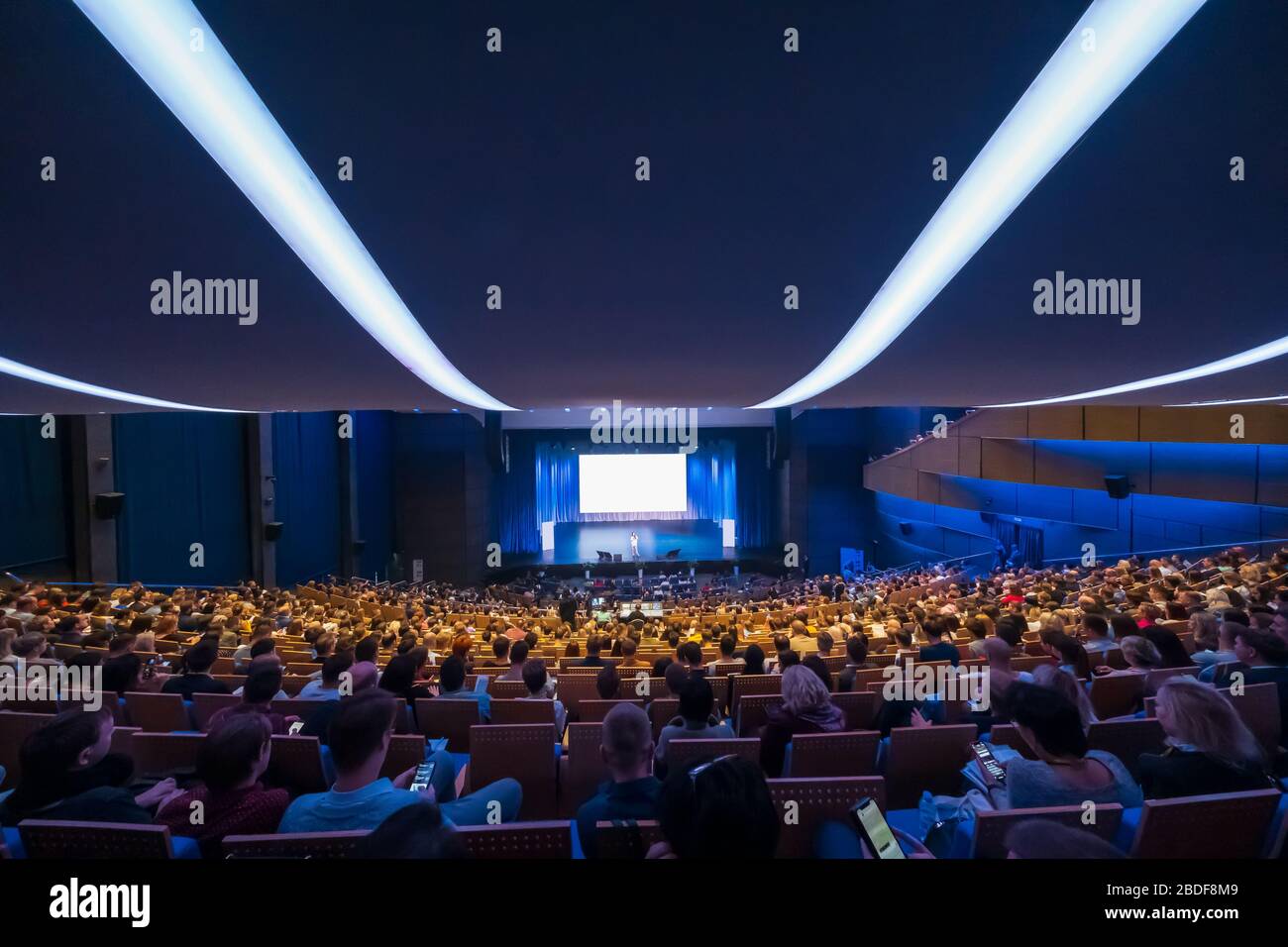 Business conference attendees sit and listen Stock Photo - Alamy