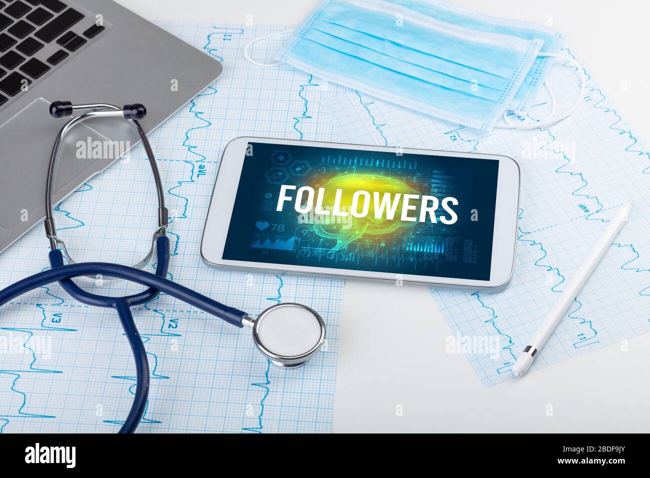 Tablet pc and medical tools with FOLLOWERS inscription, social ...