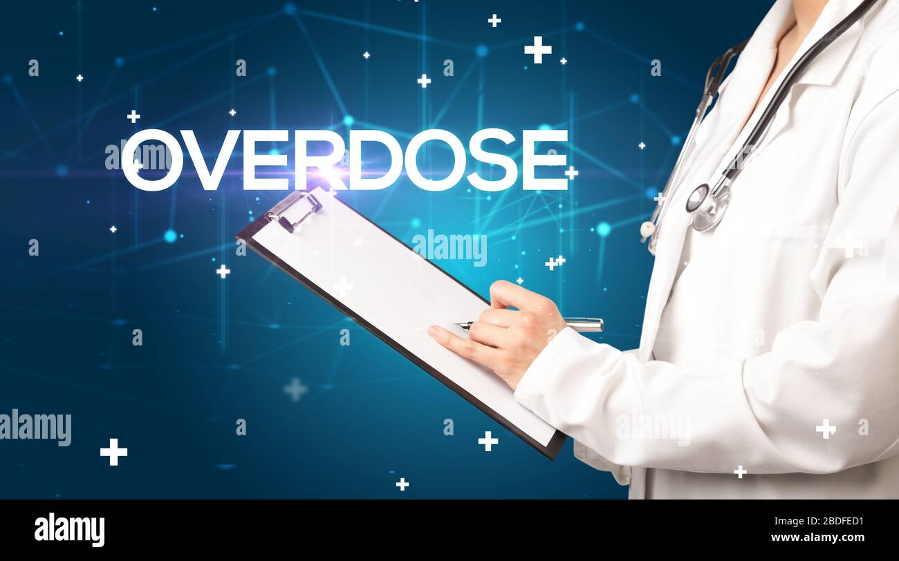 Doctor fills out medical record with OVERDOSE inscription, medical ...