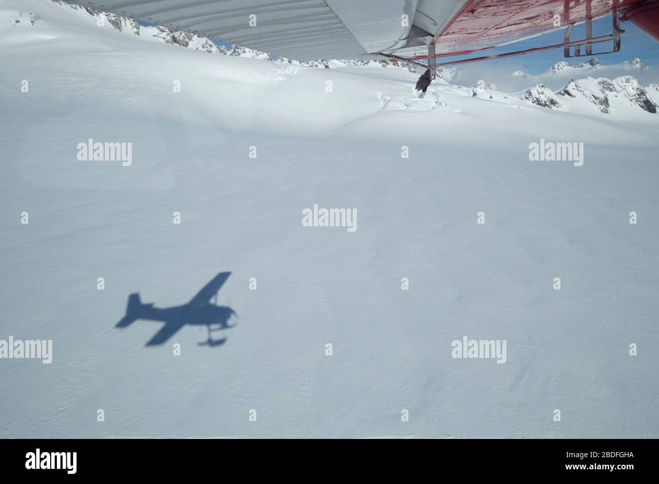 Plane over snow capped mountain hi-res stock photography and images - Alamy