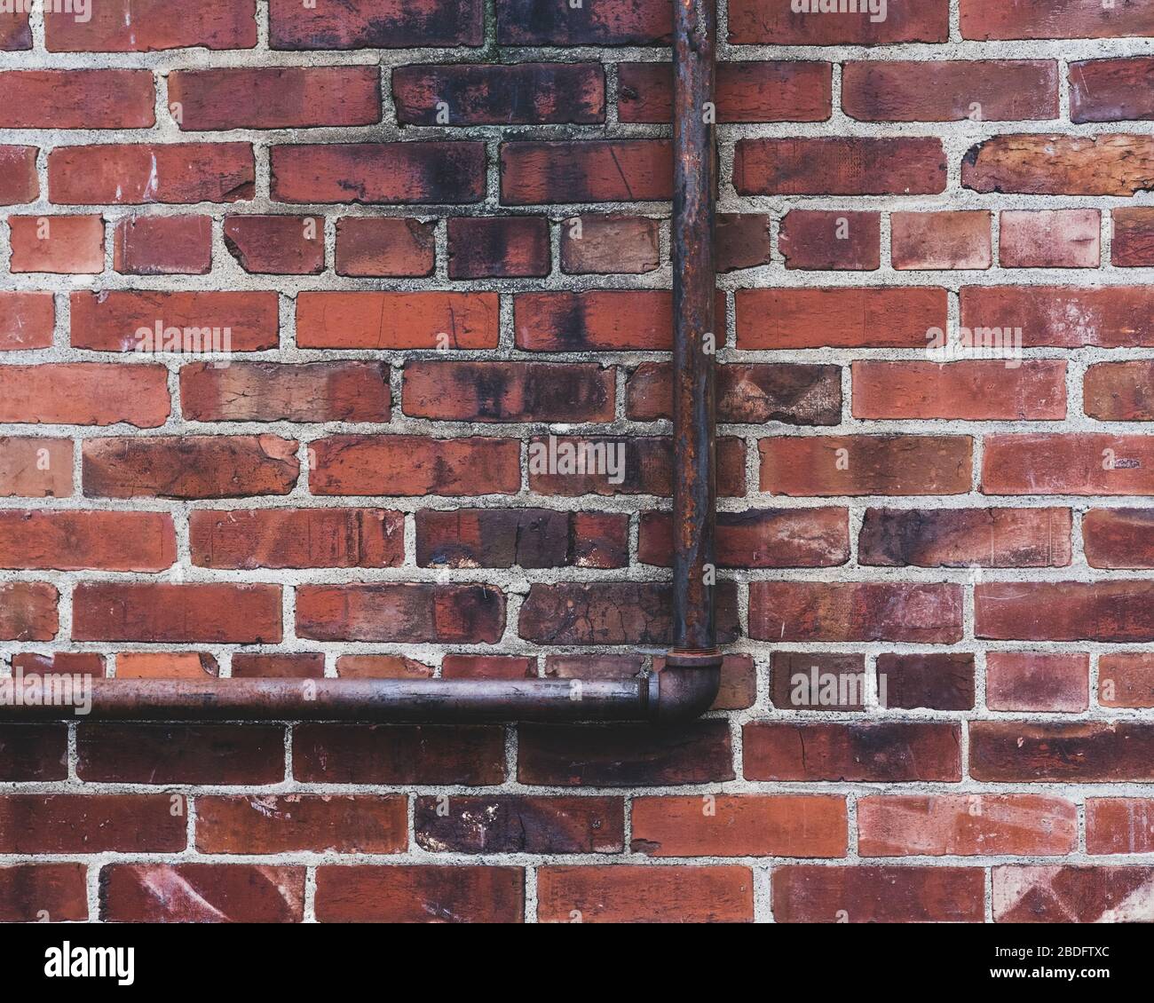 Gas utility pipe against brick wall Stock Photo - Alamy