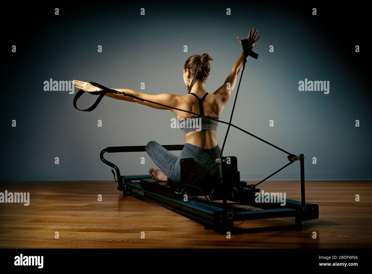 The reformer simulator, the girl the Pilates trainer does exercises for ...