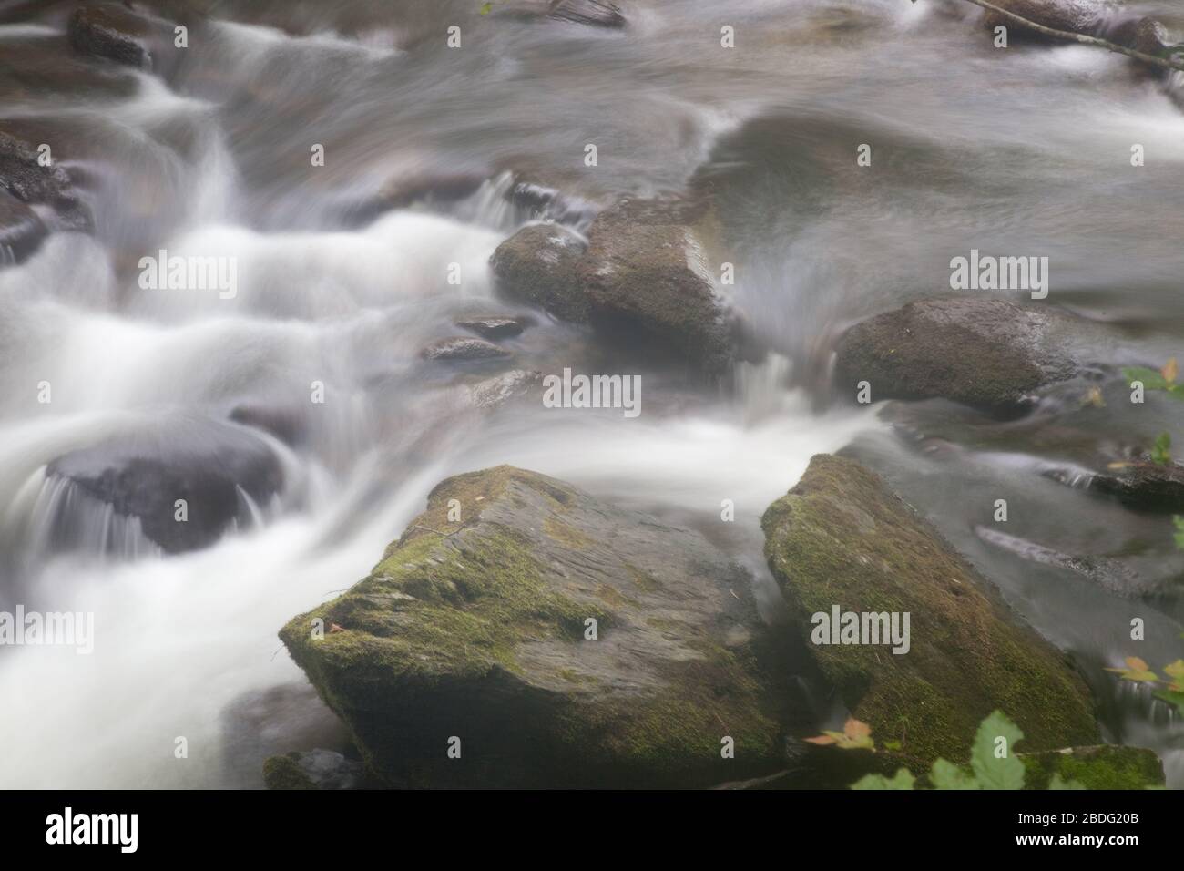 Cascading over rocks outdoors Stock Photo - Alamy