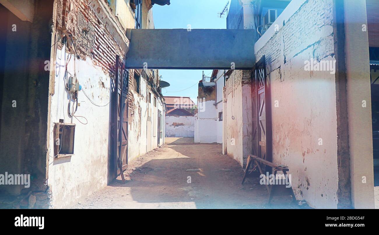 Quiet Inner City Alley Background at noon Stock Photo - Alamy