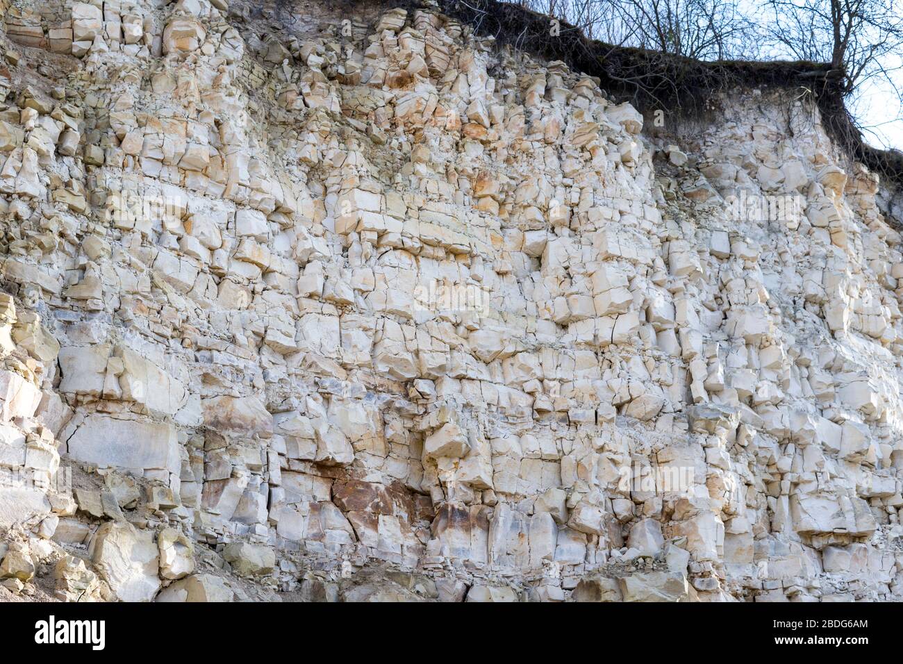 outcrop of white limestone rock formation with steep slope in Poland ...
