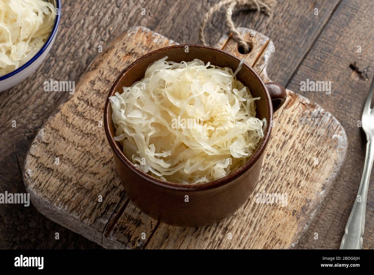 Fermented cabbage in a brown pot Stock Photo - Alamy