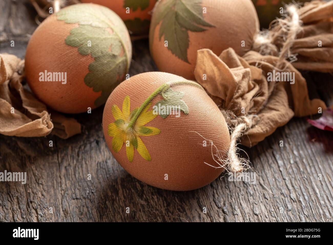 Preparation of Easter eggs for dying with onion peels with a pattern of ...