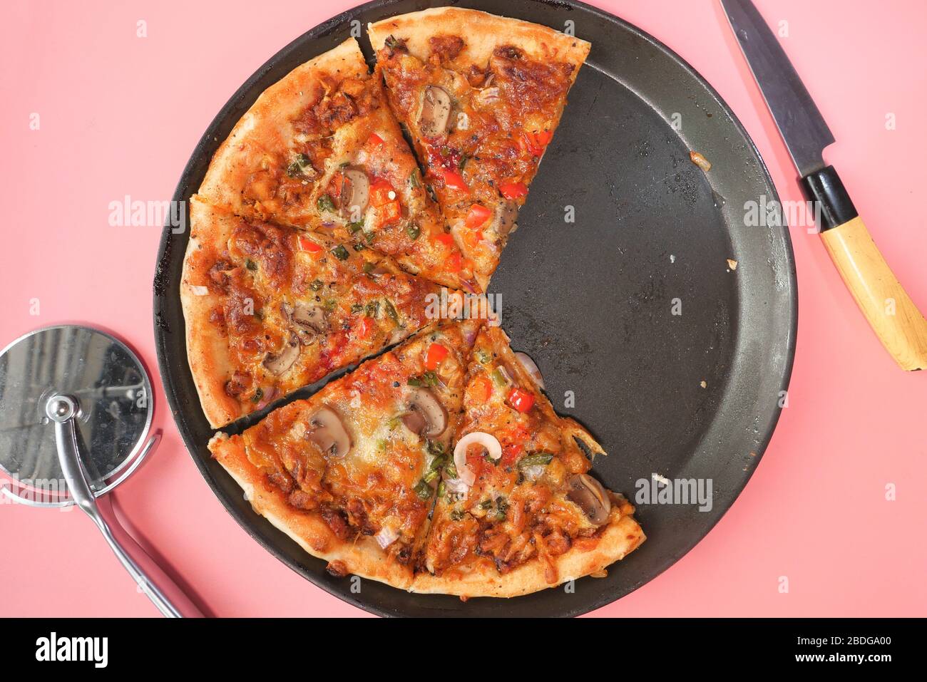 Homemade pizza on plate on pink background, high angle view Stock Photo ...
