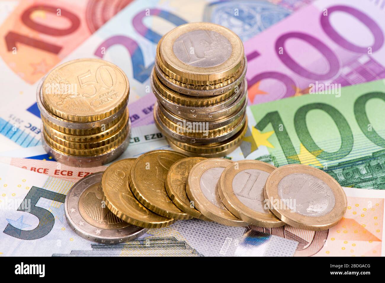 heap of banknotes of Euo currency with coins Stock Photo - Alamy