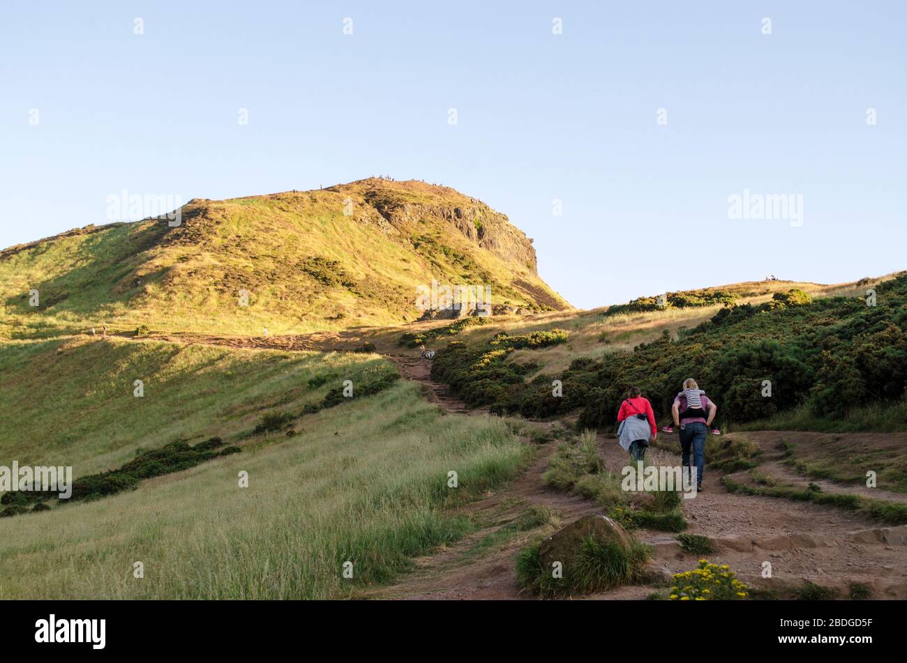 Walking Through Hills at Dusk Stock Photo - Alamy