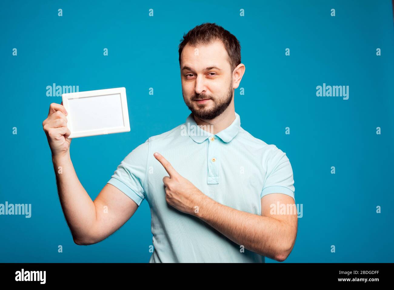 A man is on the blue background. A man with a white frame. A man with ...