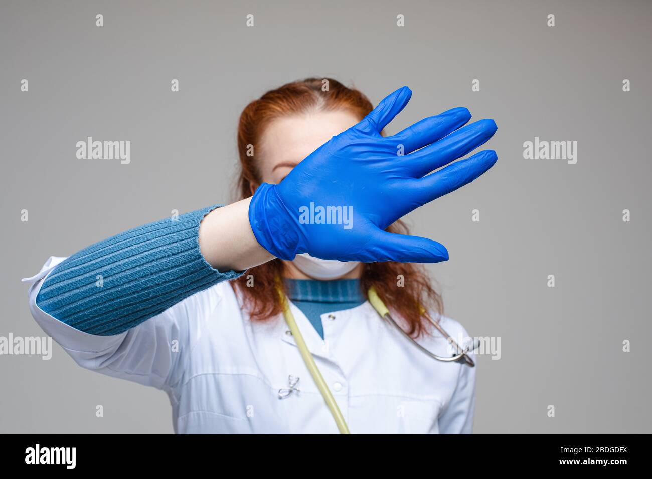 Nurse or doctor with stop sign gesture Stock Photo - Alamy