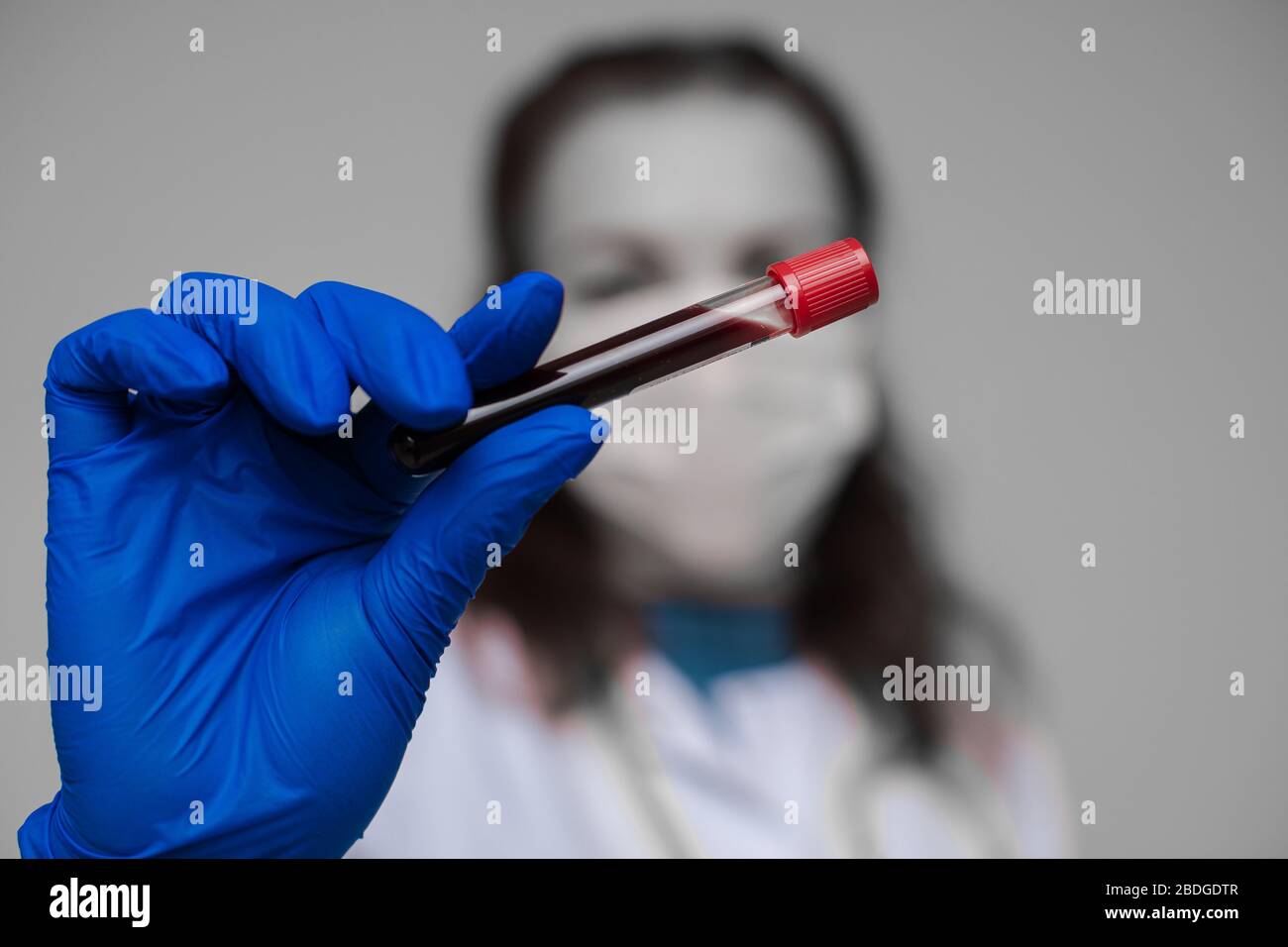 Lab worker with blood test in tube Stock Photo - Alamy