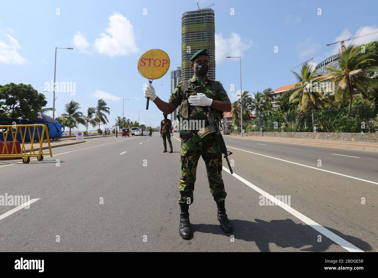 Sri Lankan police Special Task Force officer at a check point implement ...