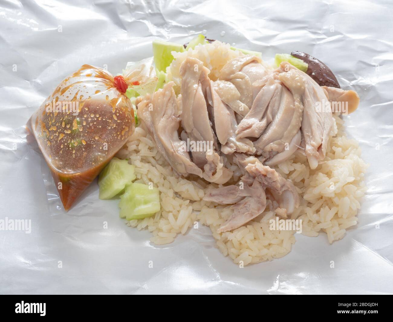 The close up of Thai chicken rice food on paper sheet Stock Photo - Alamy