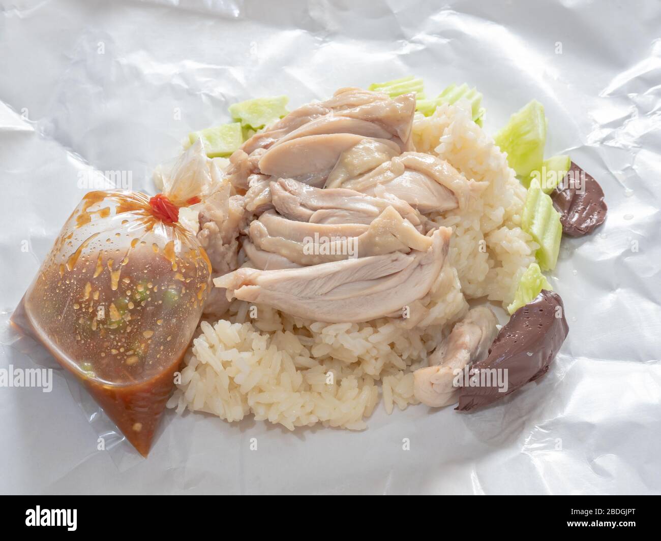 The close up of Thai chicken rice food on paper sheet Stock Photo - Alamy