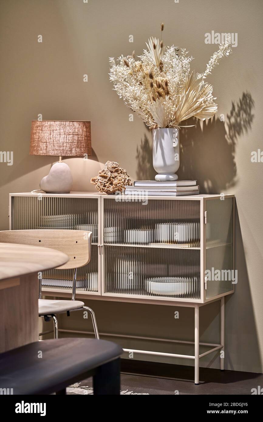 Illuminated room with light walls and furniture Stock Photo - Alamy