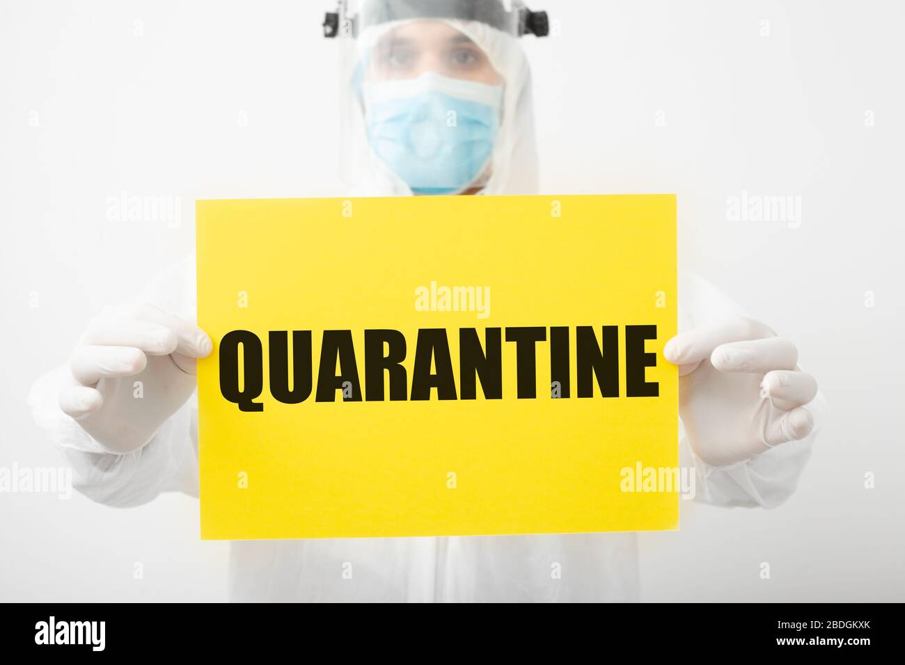 Quarantine, yellow warning sign with text Quarantine in doctor hands ...