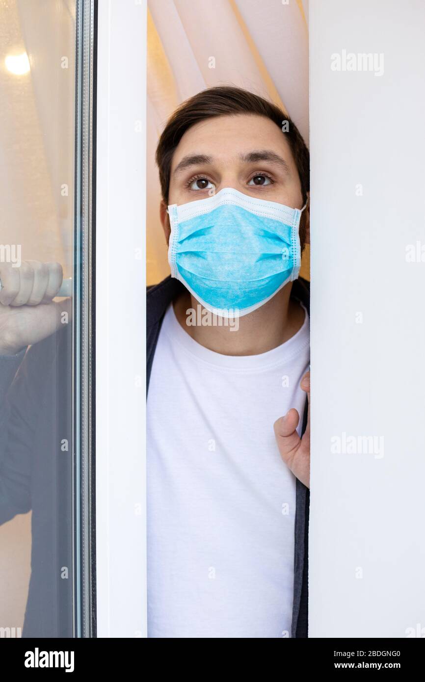 Quarantined lonely man with covid-19 in home self insulation look from ...