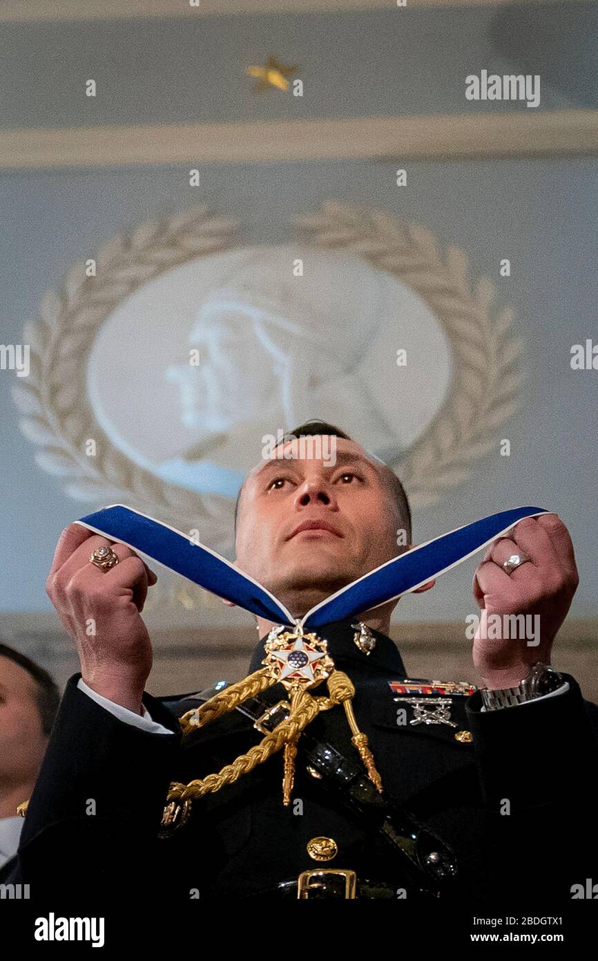 White House military aide U.S. Marine Lt. Col. Rogello Maese holds the ...
