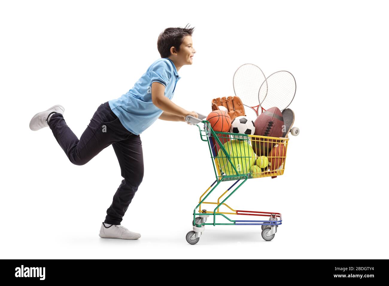 Full length profile shot of a boy running and pushing a small shopping ...