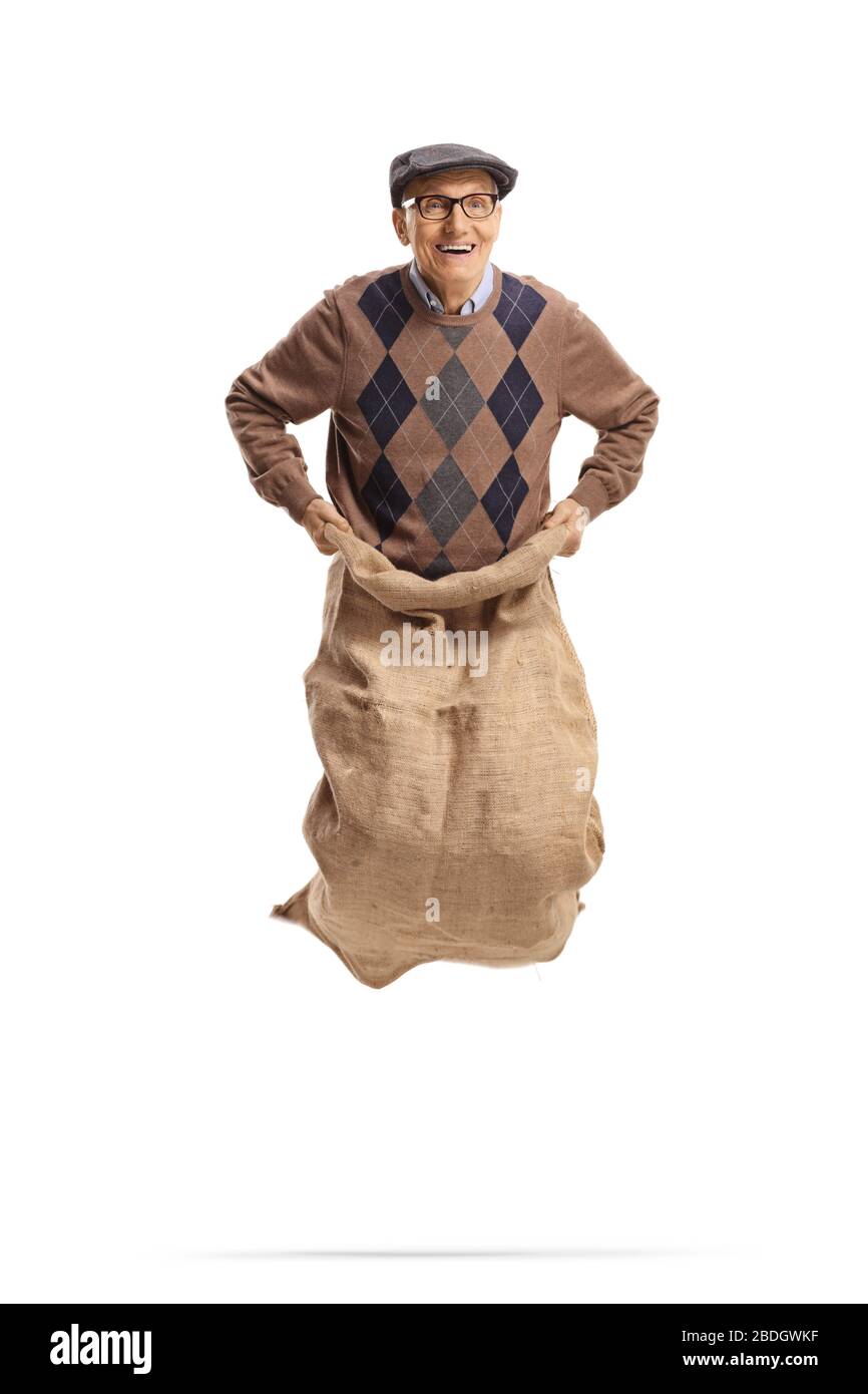 Happy elderly man jumping inside a sack isolated on white background ...