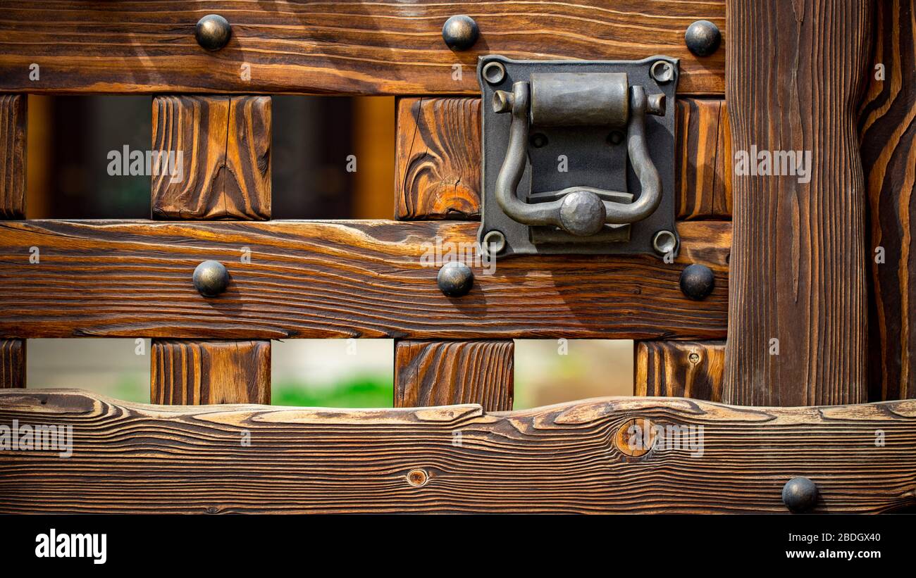 wooden gate with wrought iron elements close up Stock Photo - Alamy