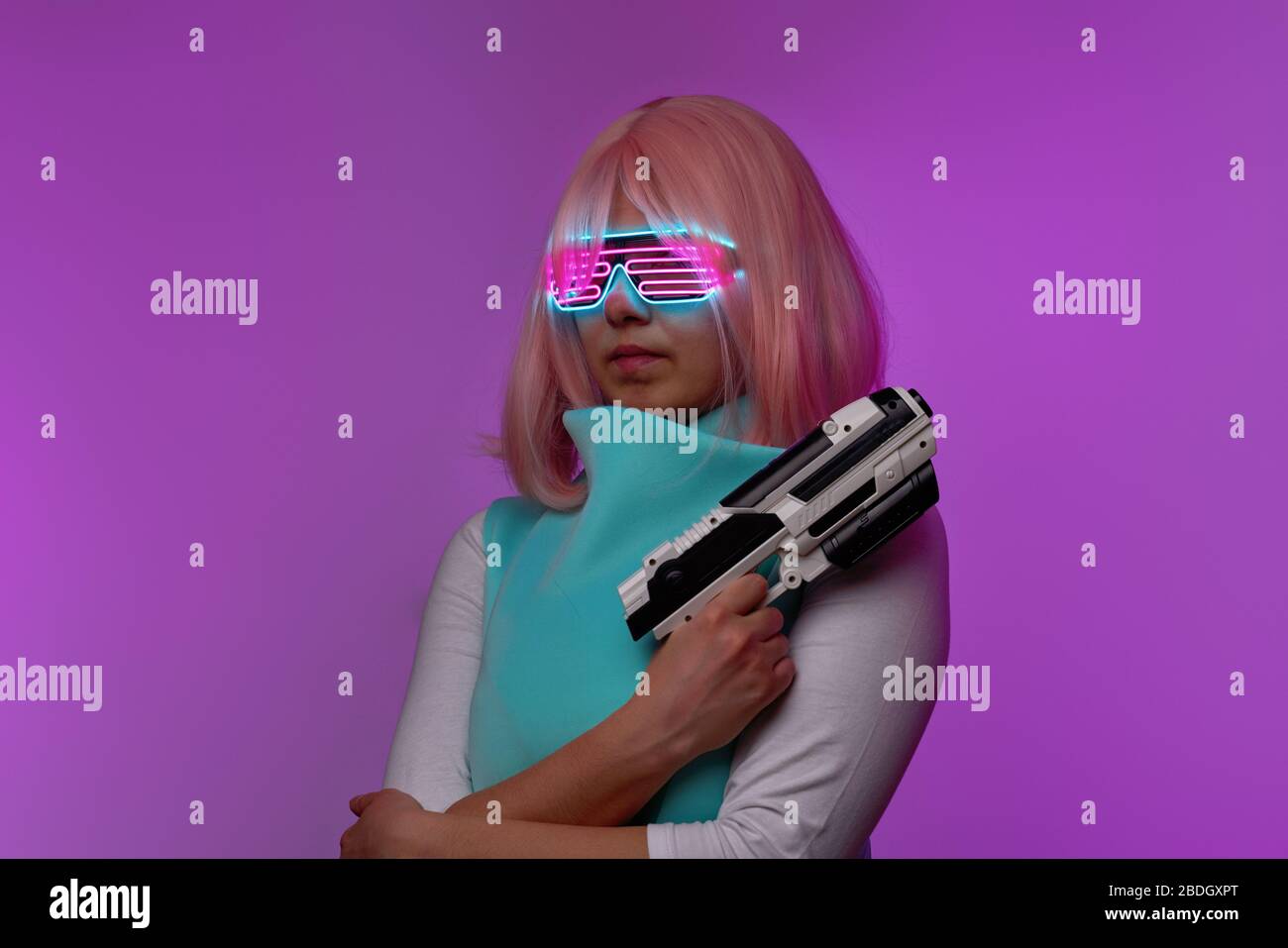 Girl with blaster in the futuristic battle. Concept virtual reality ...