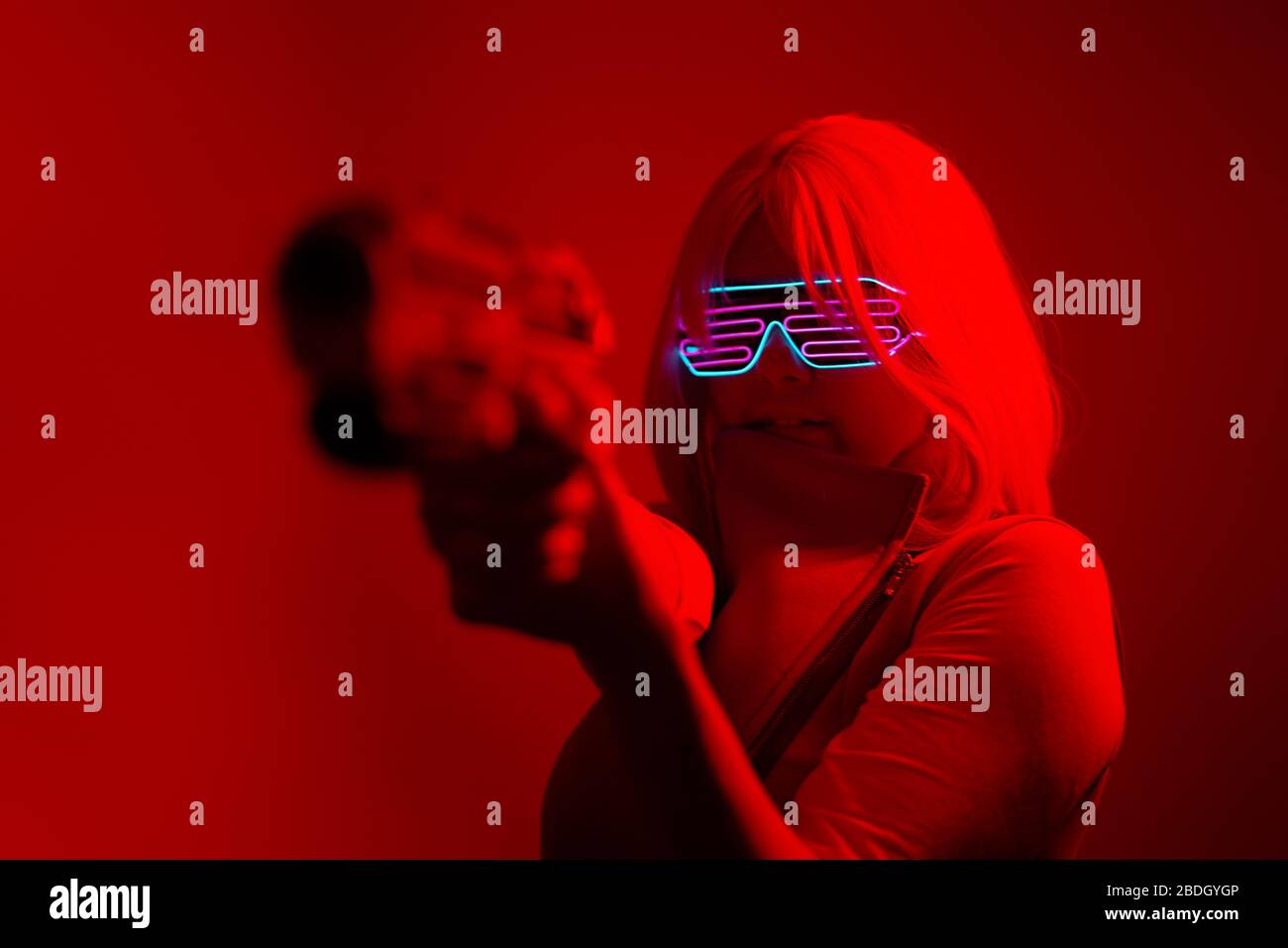 Girl with blaster in the futuristic battle. Concept virtual reality ...