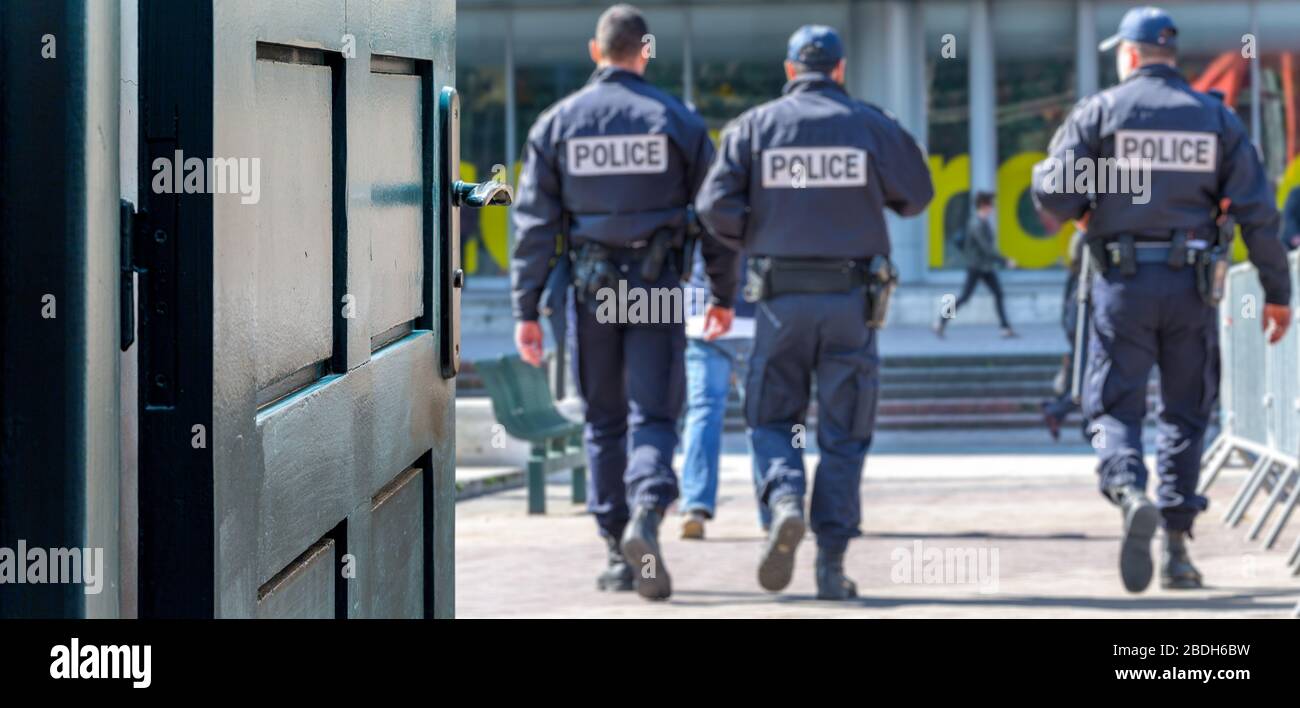Opened door concept with a police patrol in the background blurred ...