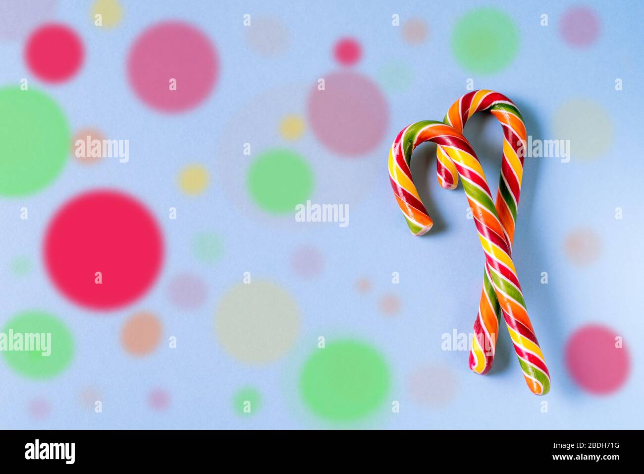 Flat lay Candy cane on festive Christmas pastel background Stock Photo - Alamy