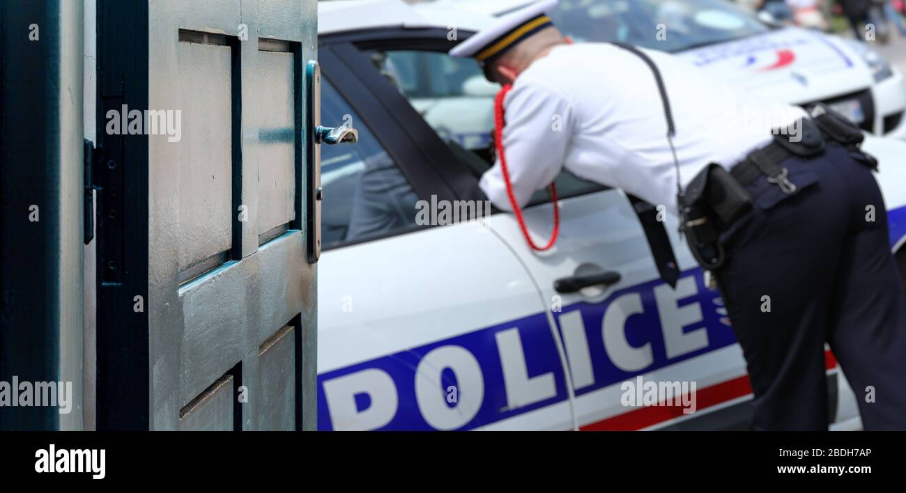 Opened door concept with a police patrol in the background blurred ...