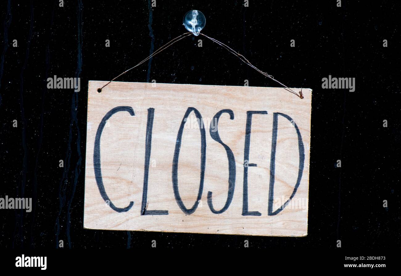 A closed sign in the window of a UK business during the coronavirus ...