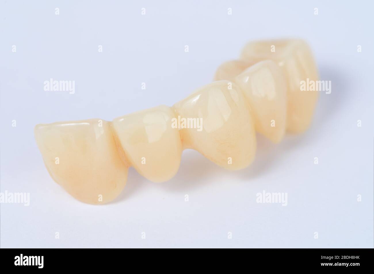 Close up ceramic tooth crown Stock Photo - Alamy
