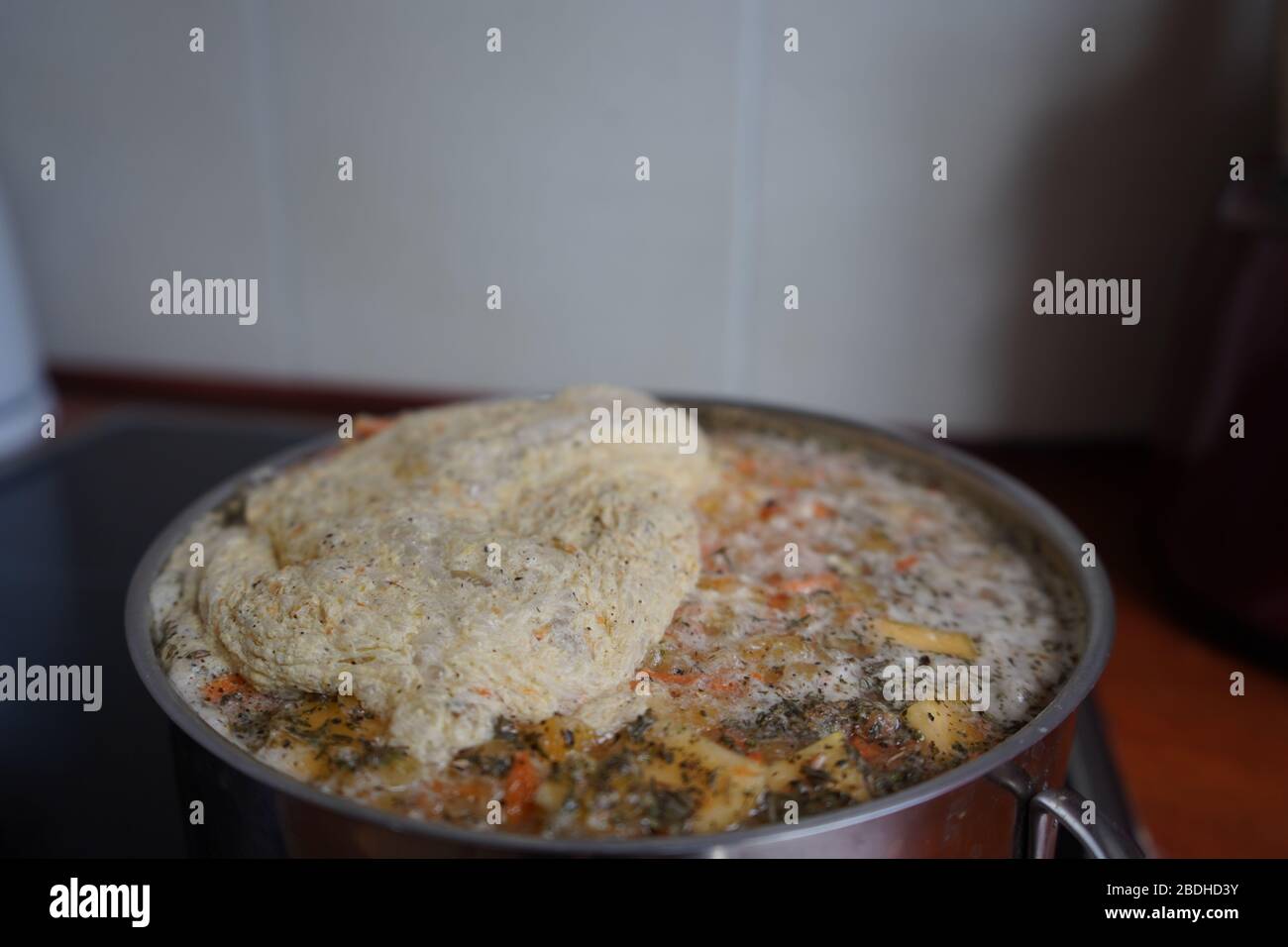 Dirty stuff on the top of boiling peas pot Stock Photo - Alamy