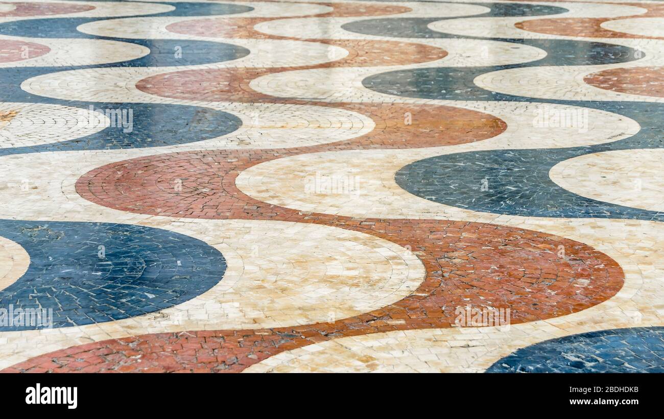 Colorful cobblestone pavement in Alicante, Spain, textured background ...