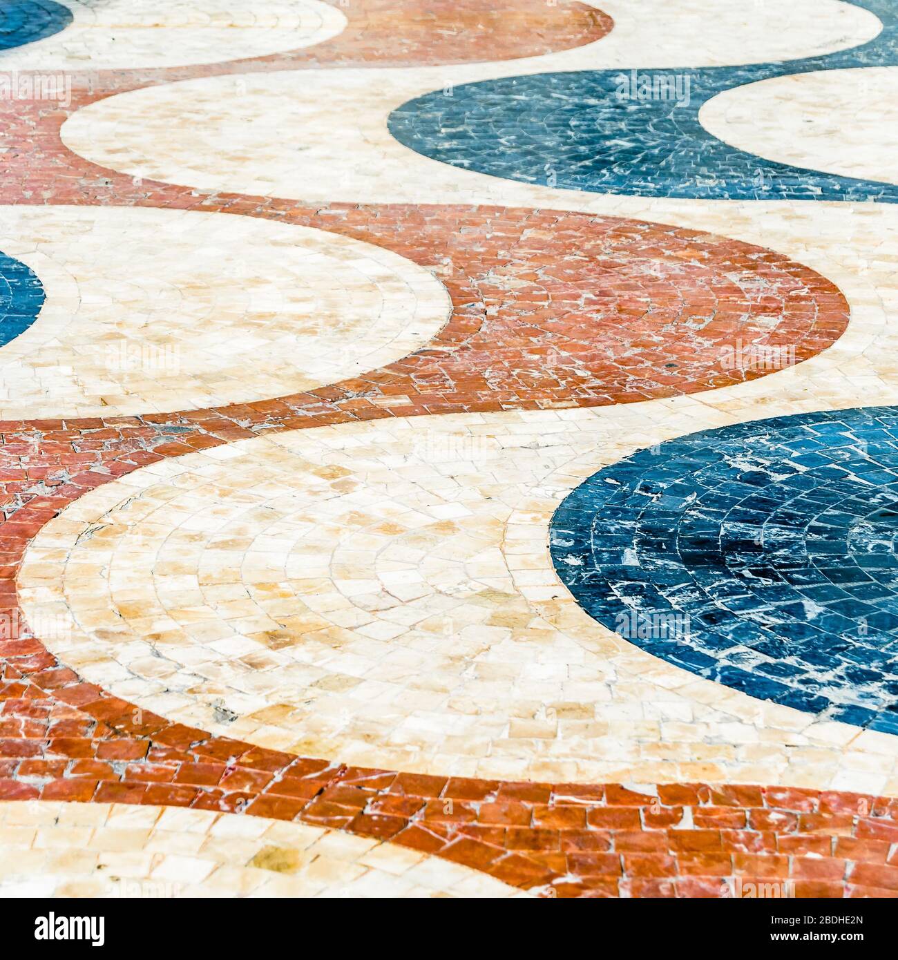 Colorful cobblestone pavement in Alicante, Spain, textured background ...