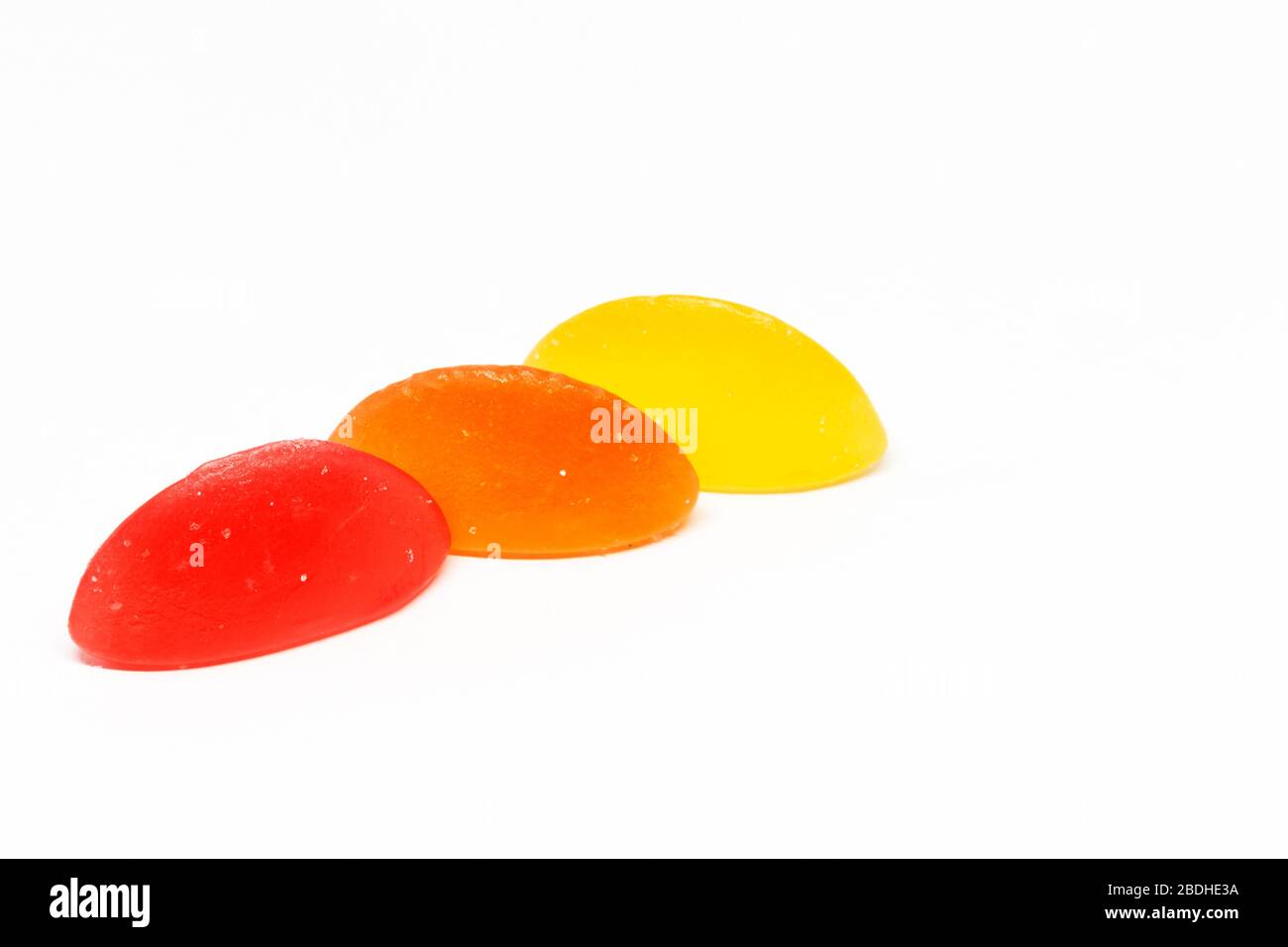 three pieces of raspberry boats sweets on white background Stock Photo ...
