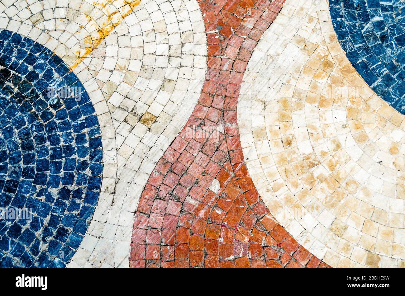 Colorful cobblestone pavement in Alicante, Spain, textured background ...