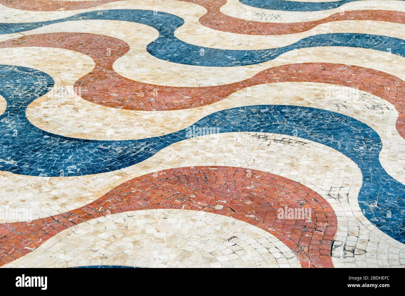 Colorful cobblestone pavement in Alicante, Spain, textured background ...