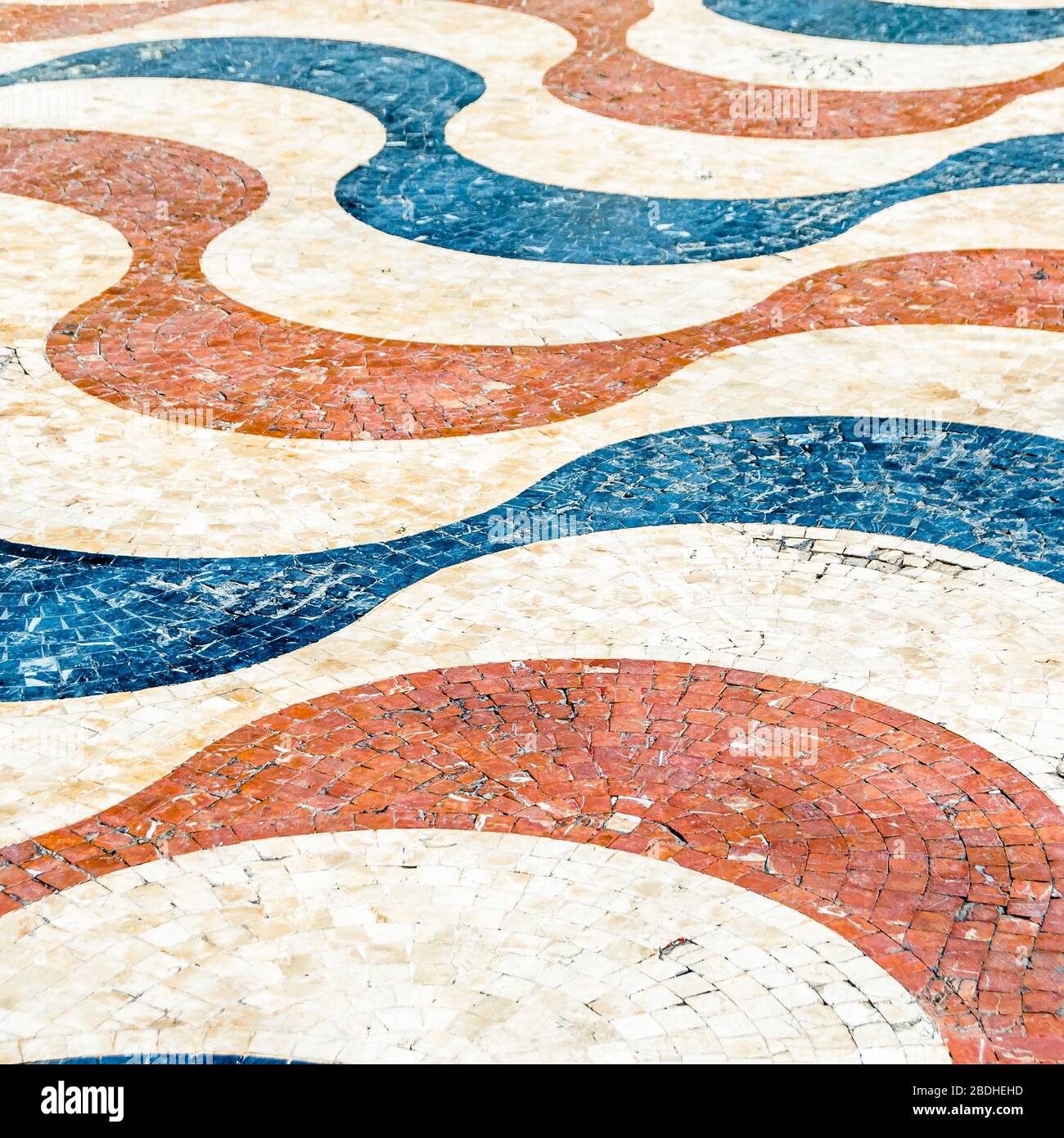 Colorful cobblestone pavement in Alicante, Spain, textured background ...
